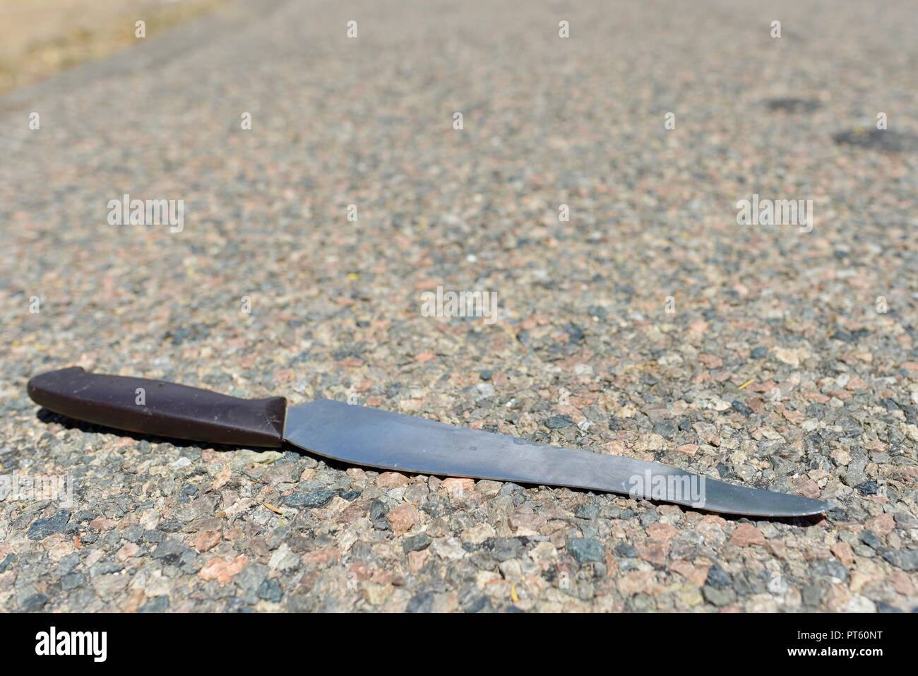 A knife lying on a road, Townsville, QLD, Australia Stock Photo - Alamy