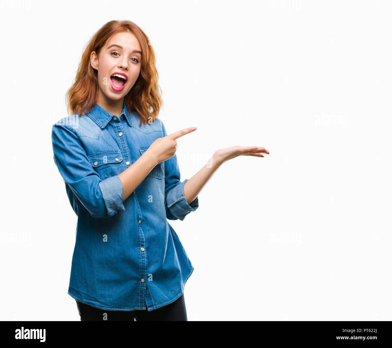 Young beautiful woman over isolated background amazed and smiling to ...