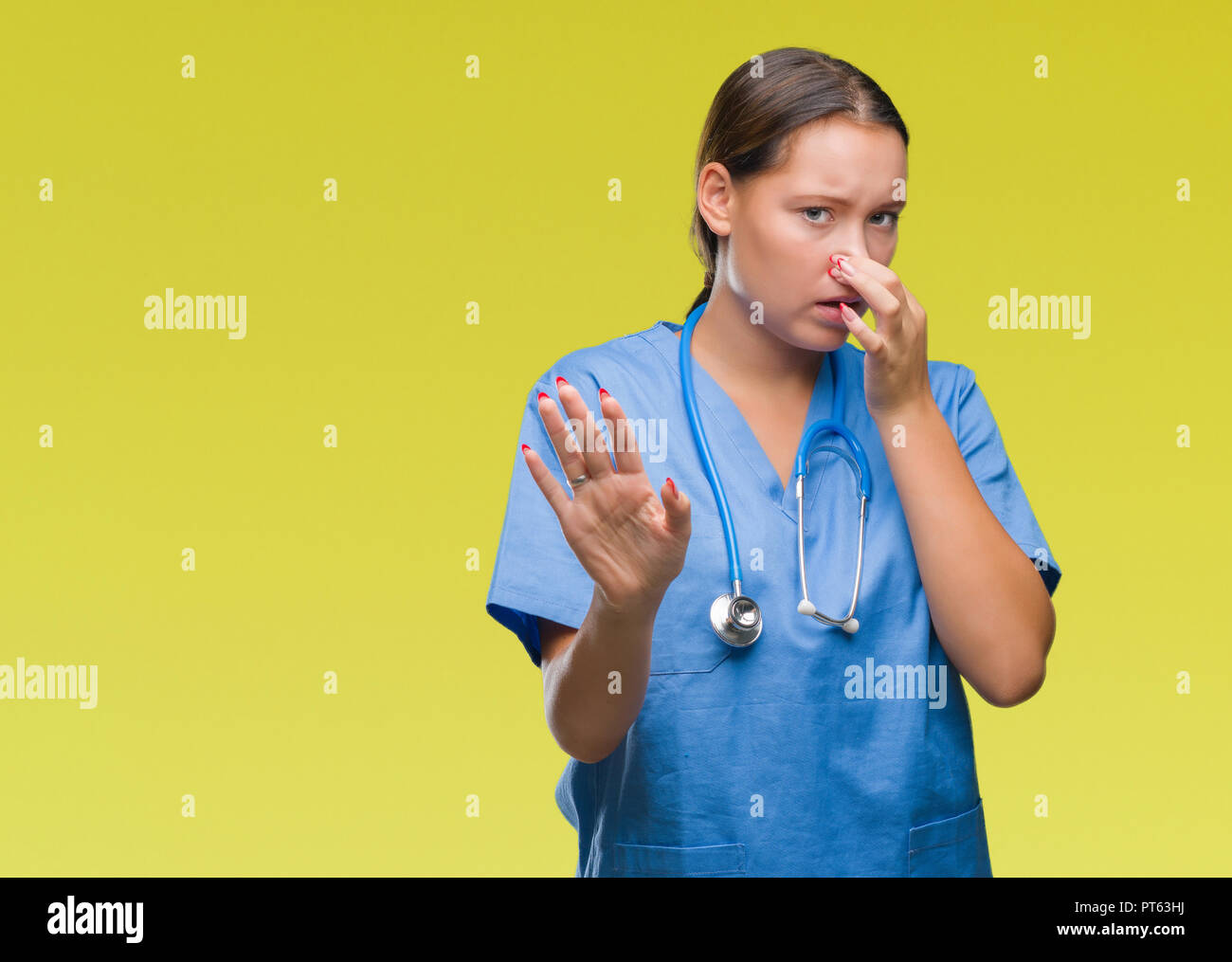 Young caucasian doctor woman wearing medical uniform over isolated ...