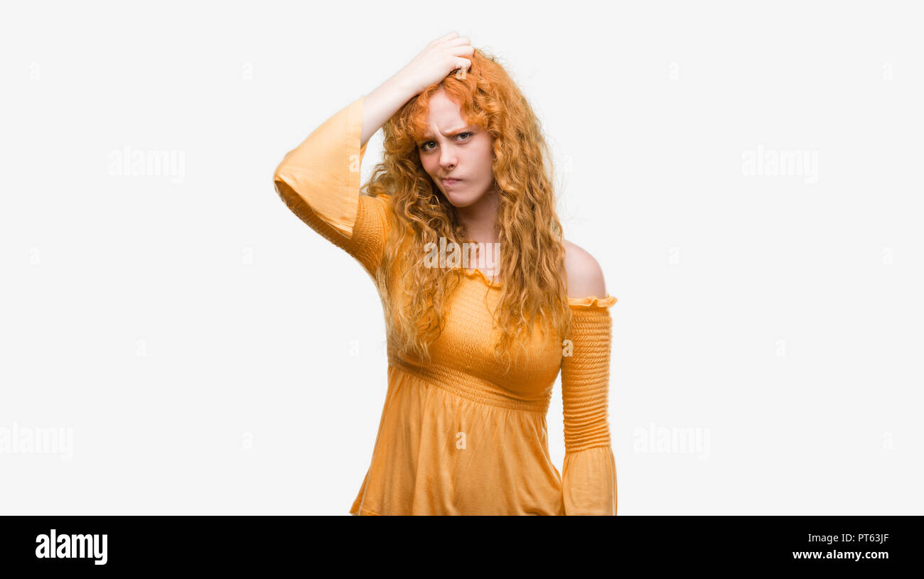 Young redhead woman confuse and wonder about question. Uncertain with ...