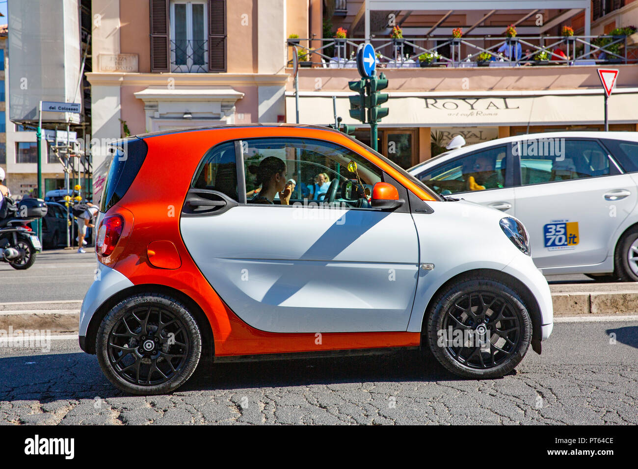 Young lady driving a modern smart car through Rome,Italy,Europe Stock ...