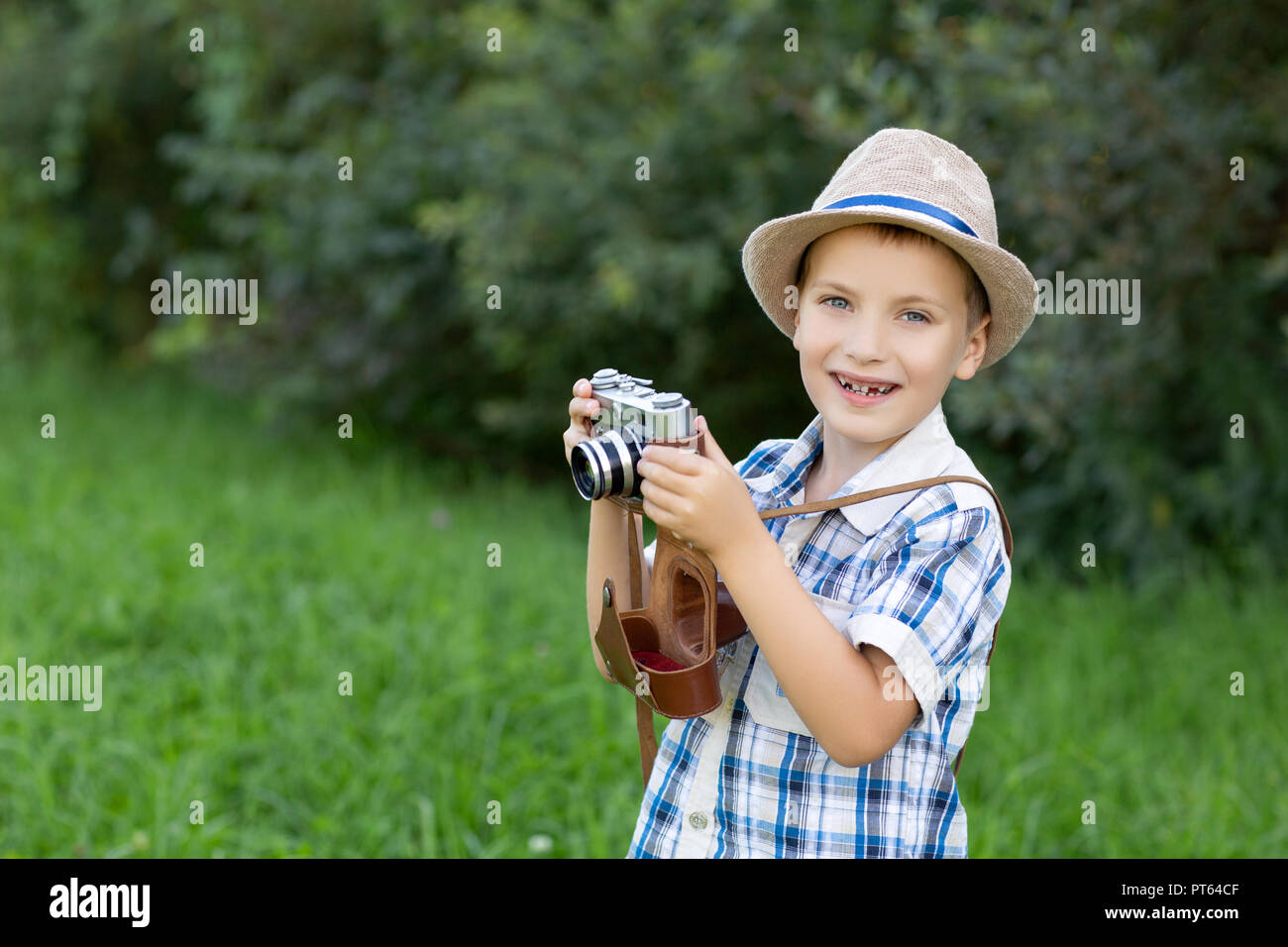 Handsome young boy retro camera hi-res stock photography and images - Alamy