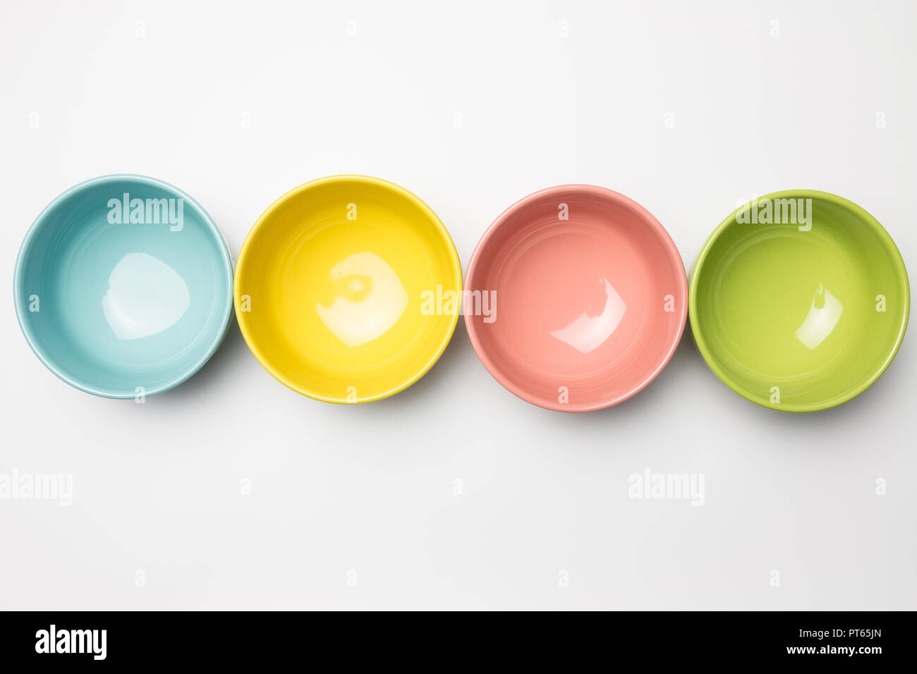 Colored bowls on white background Stock Photo - Alamy
