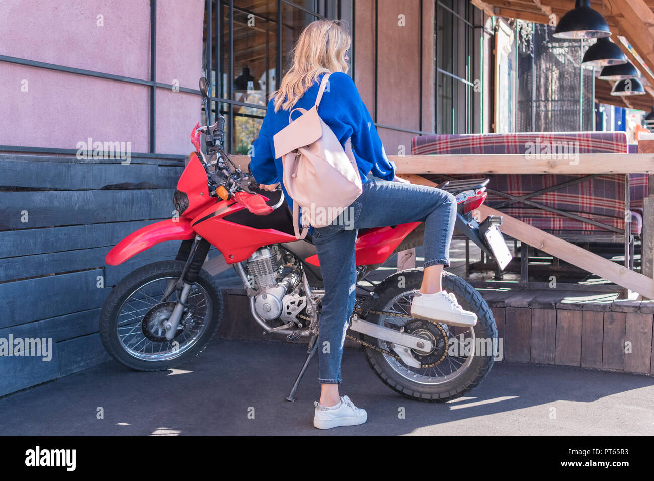 Woman riding on back motorcycle hi-res stock photography and images - Alamy