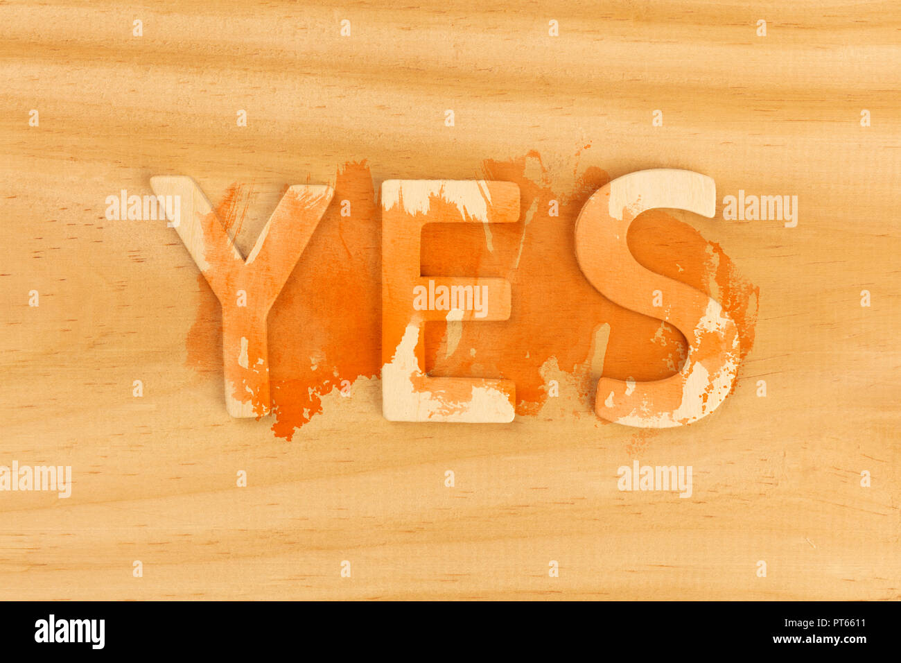 Yes, letters forming word on a wooden background with a place for text ...