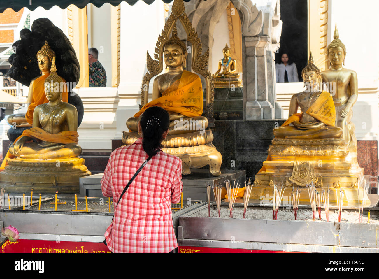 faithful pray in the Golden Buddha Temple in Bangkok, Thailand Stock ...