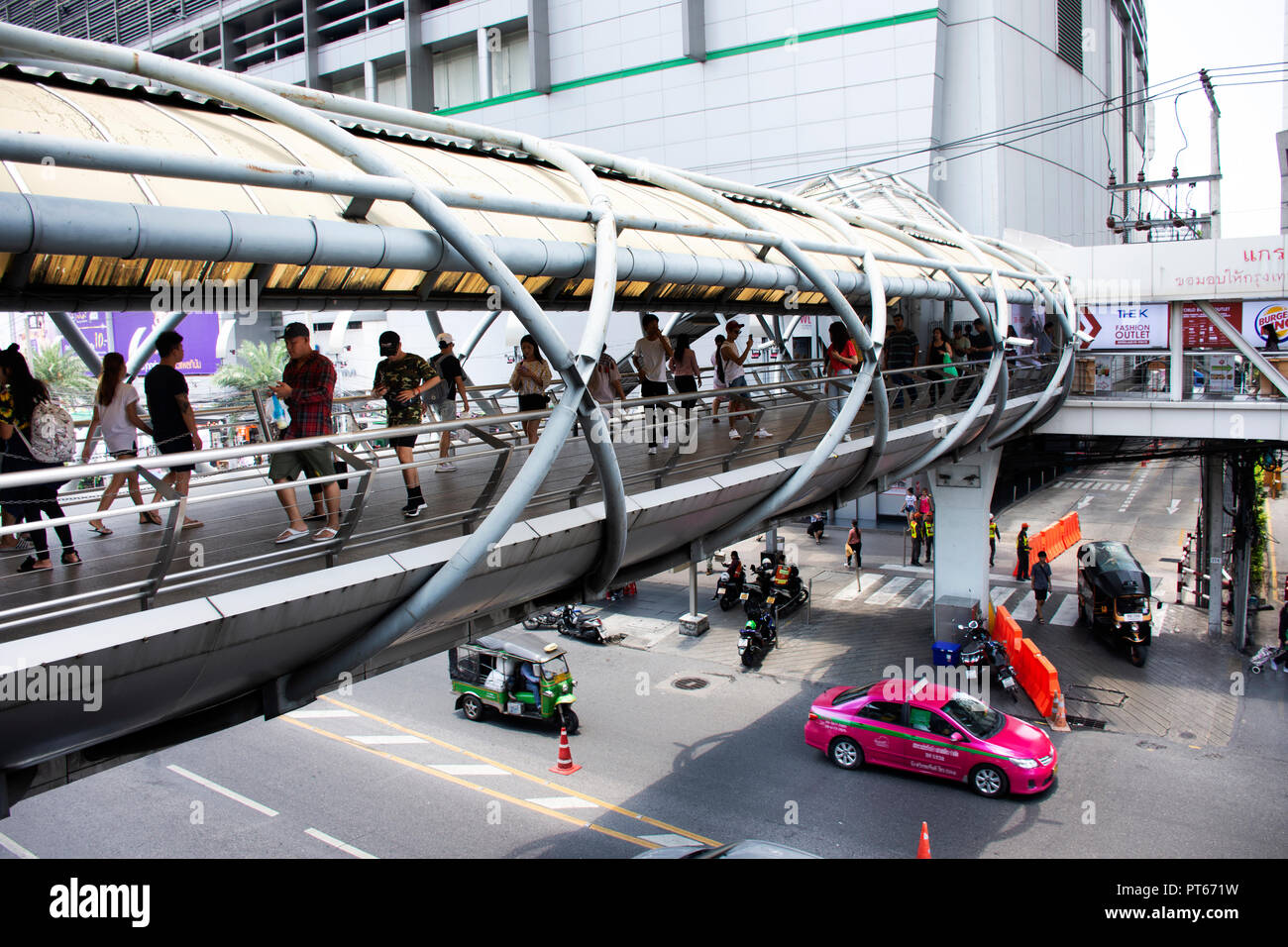 Thai people and foreigners walking crossover Petchburi Road on walkway ...