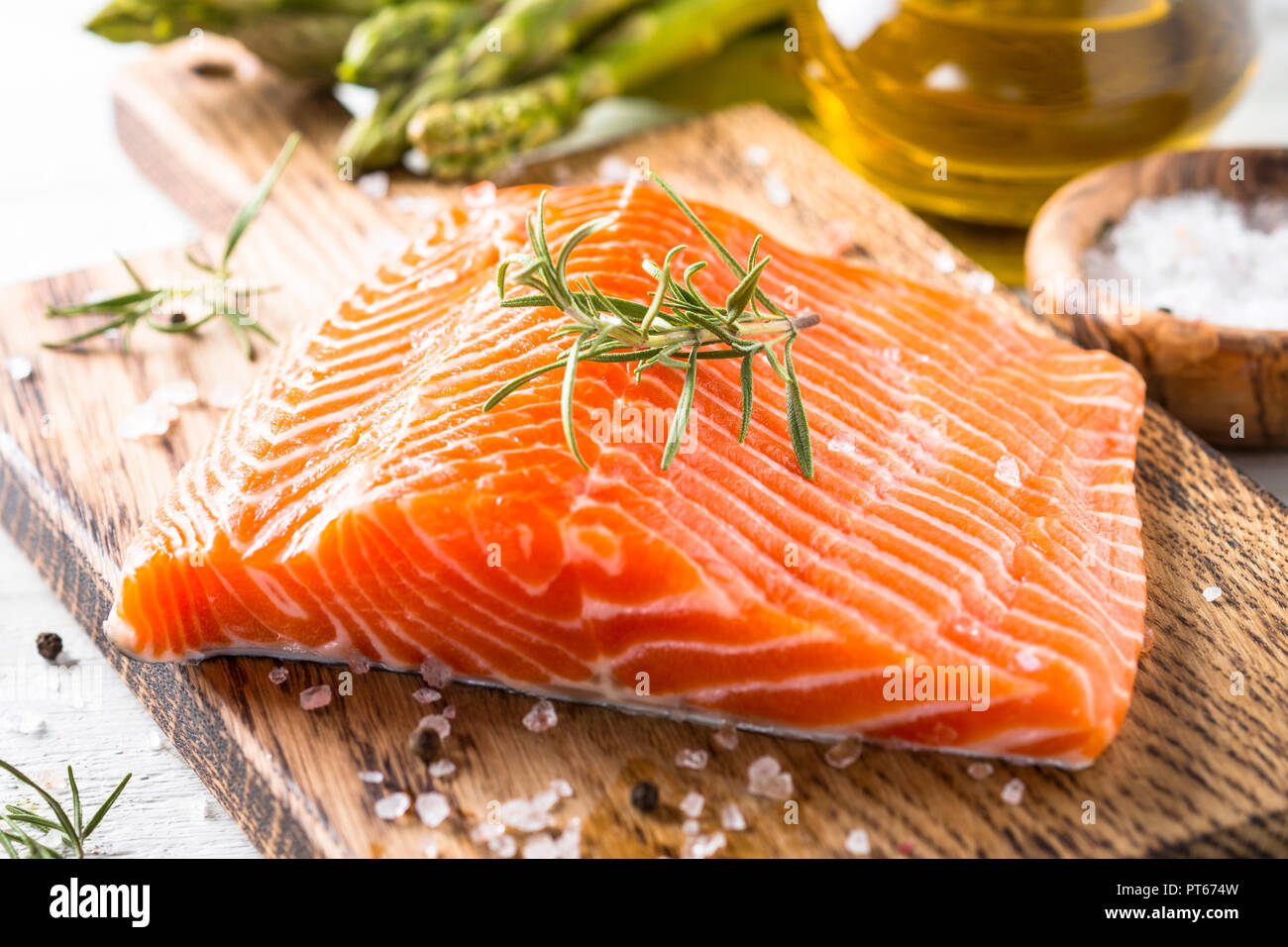 Fresh fish salmon with lemon sea salt and rosemary on white Stock Photo ...