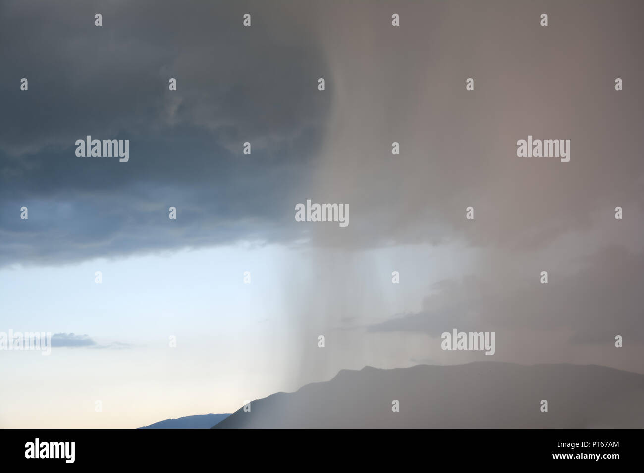 Rain curtain in the sky Stock Photo - Alamy