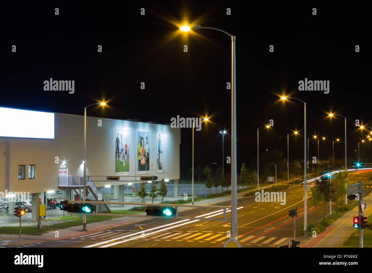Shopping mall avenue at night Stock Photo - Alamy