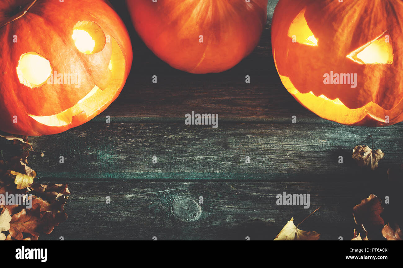 orange pumpkins for halloween with spooky faces Stock Photo - Alamy
