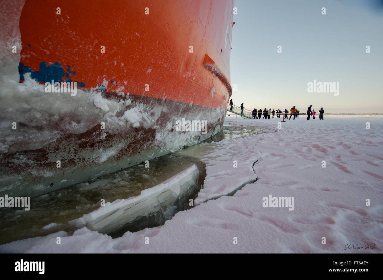 The Icebreaker ship trapped in ice tries to break and leave the bay ...
