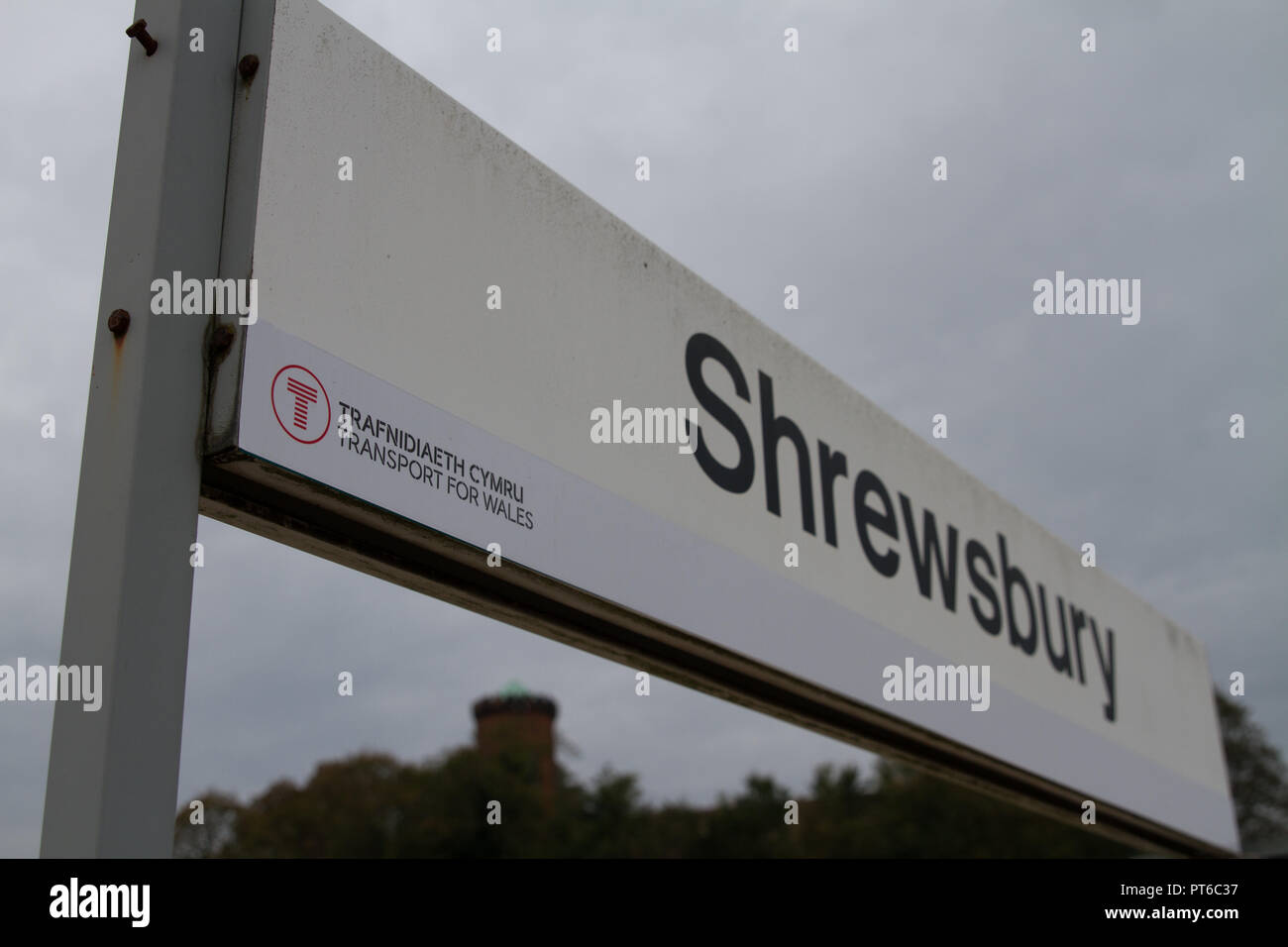Shrewsbury Railway Station in England sign against a grey sky showing ...
