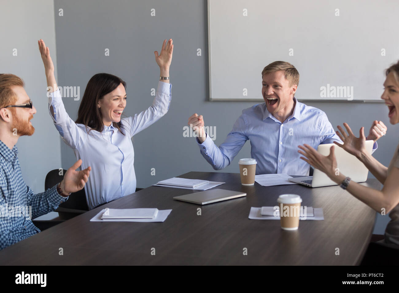 Excited motivated team coworkers celebrating unbelievable busine Stock ...