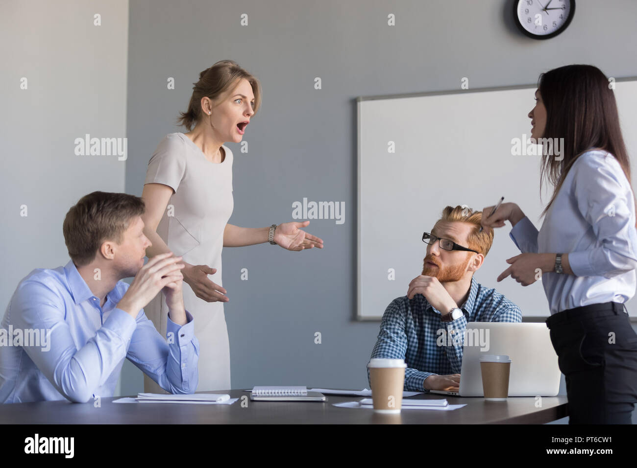 Businesswomen colleagues disputing at corporate office meeting Stock ...