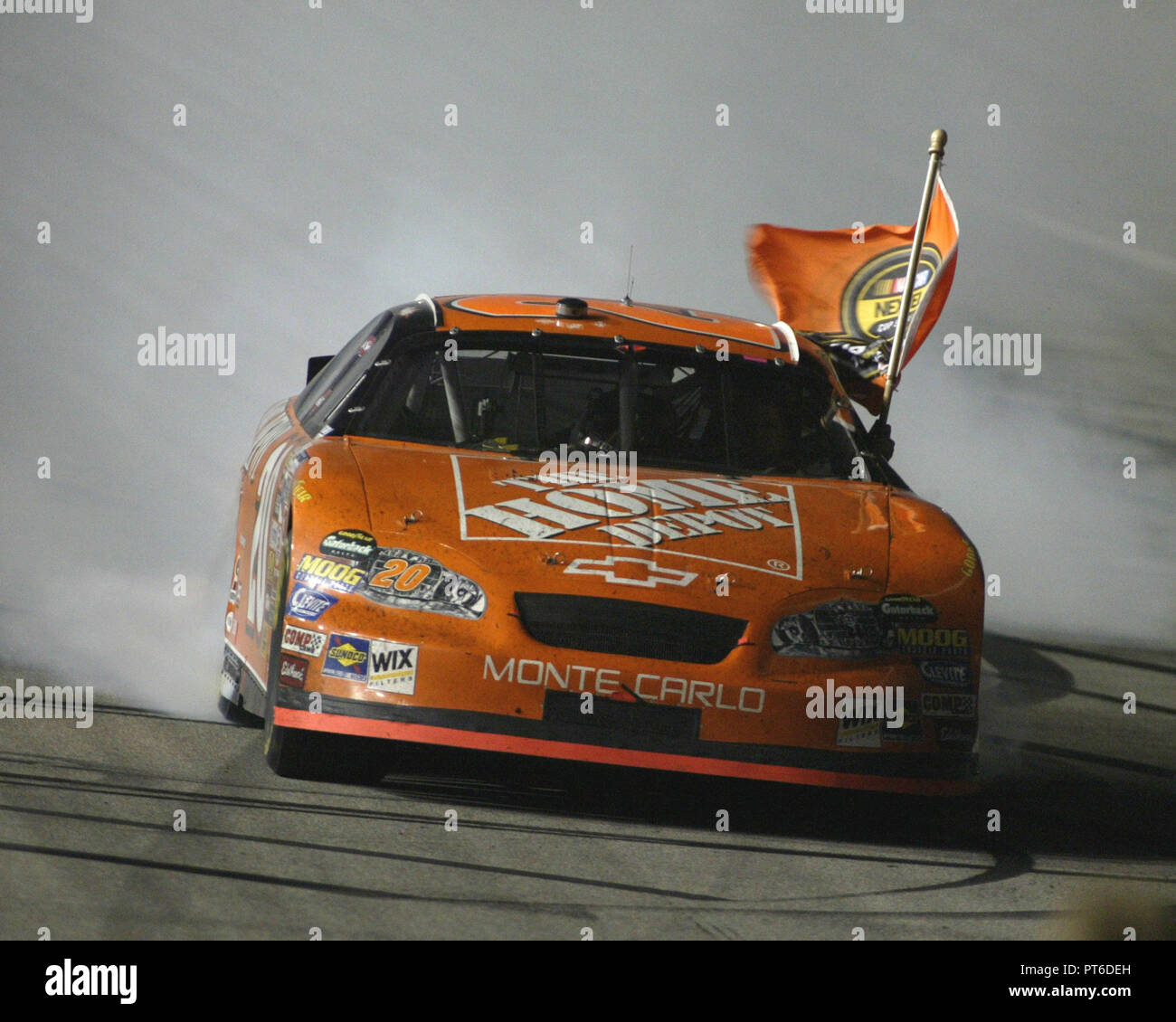 Tony Stewart celebrates winning the NASCAR Nextel championship after ...
