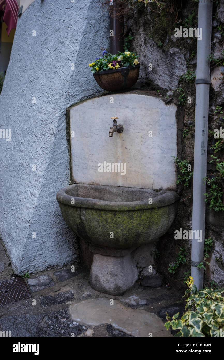 Italy, Varenna, Lake Como, a stone water tap Stock Photo - Alamy
