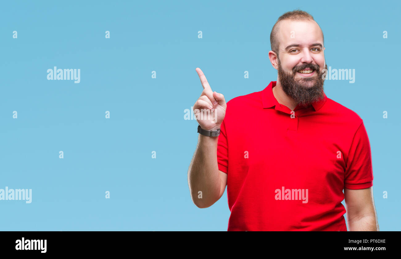 Young caucasian hipster man wearing red shirt over isolated background ...