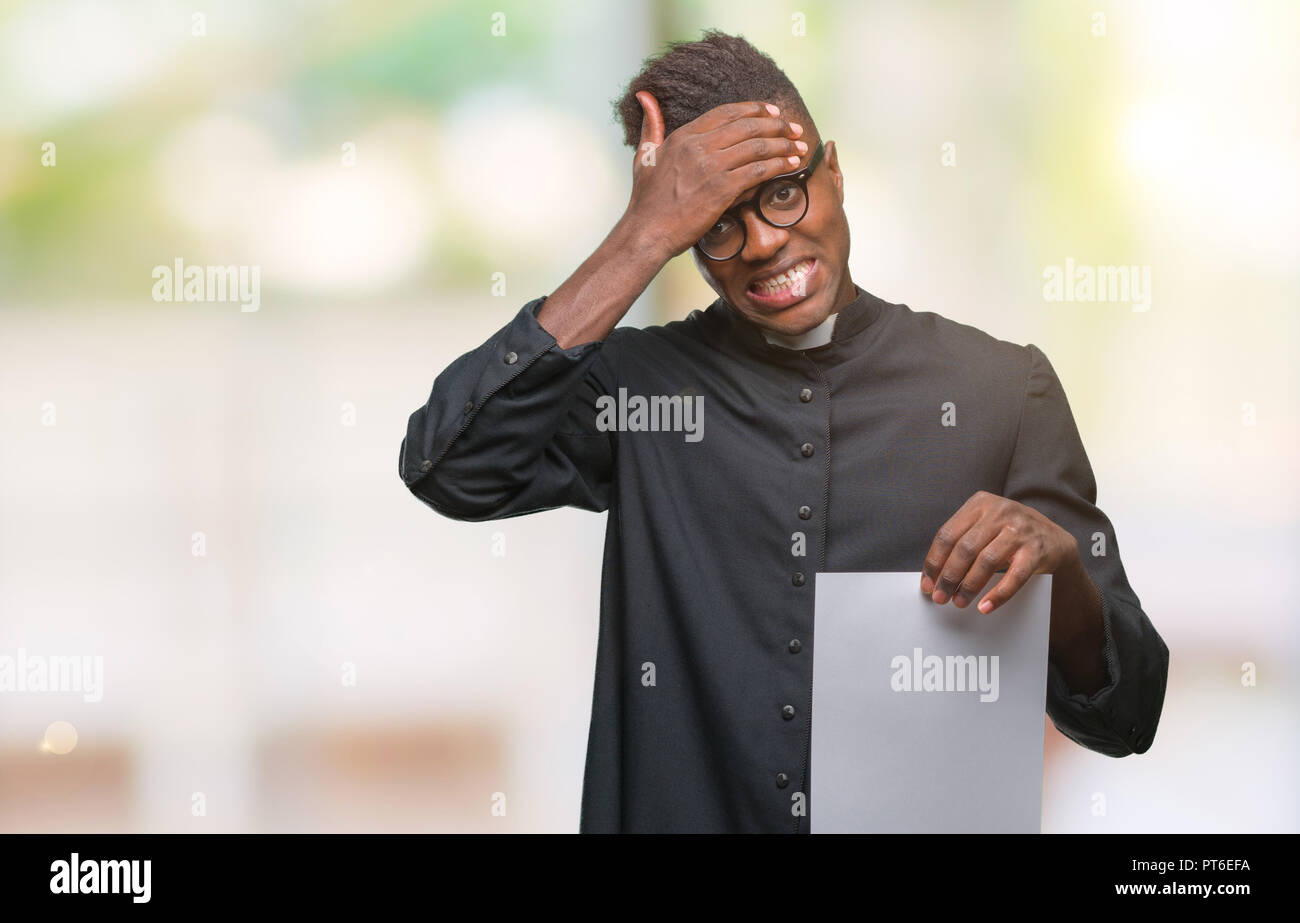 Young african american priest man over isolated background holding ...