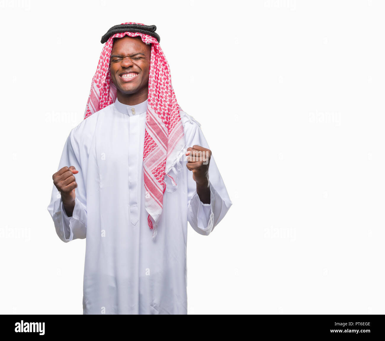 Young arabic african man wearing traditional keffiyeh over isolated ...