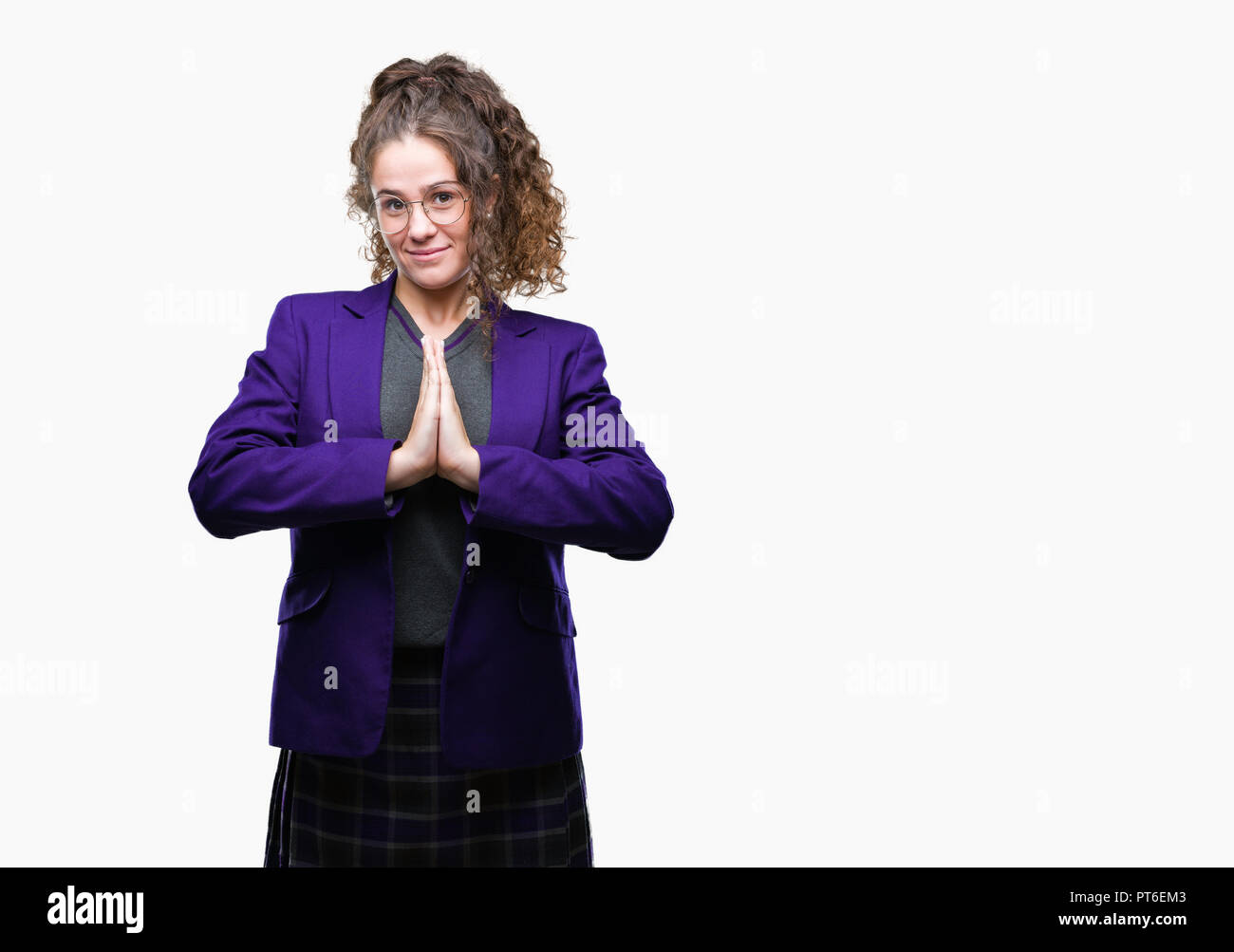 Young brunette student girl wearing school uniform and glasses over ...