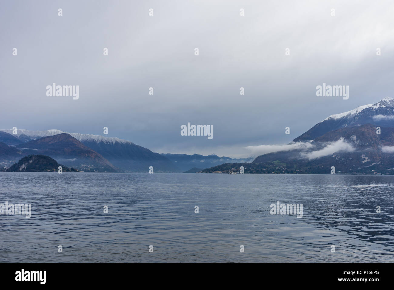 Europe, Italy, Varenna, Lake Como, a large body of water with a snowcap ...