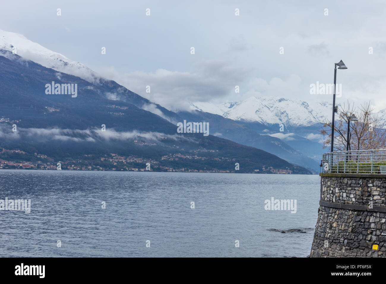 Europe, Italy, Varenna, Lake Como, a large body of water with a snowcap ...