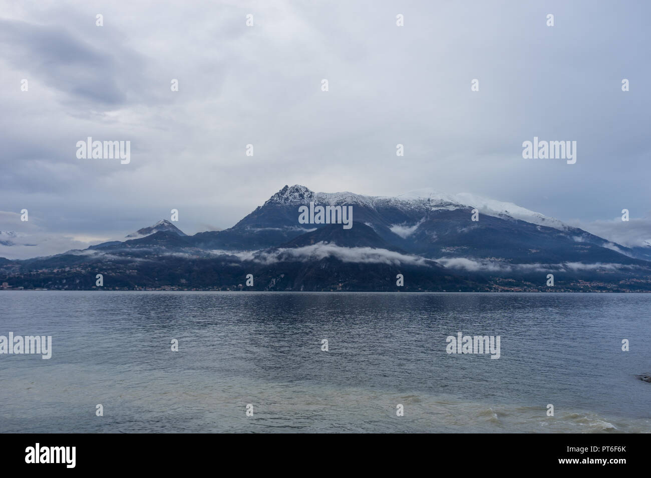 Europe, Italy, Varenna, Lake Como, a body of water with a snowcap ...