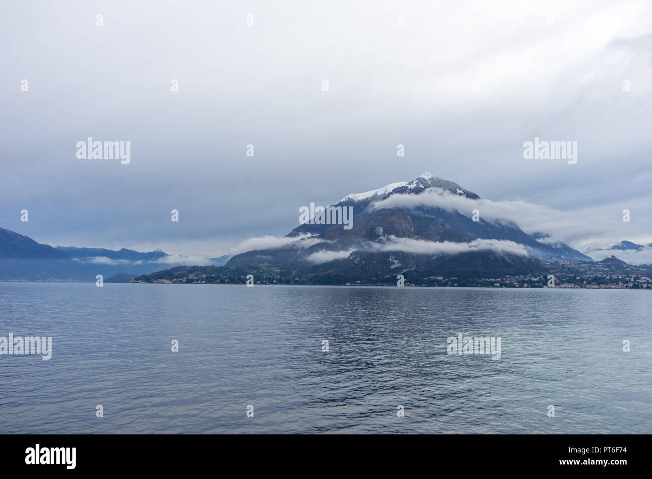 Europe, Italy, Varenna, Lake Como, a large body of water with a snowcap ...