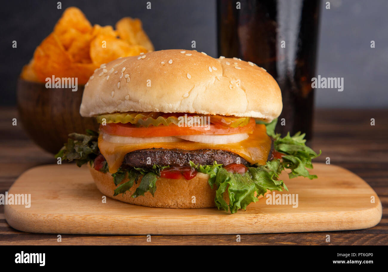 A Perfect Beef Hamburger with All the Fixings with an Ice Cold Soda ...