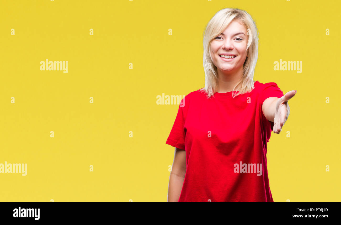 Young beautiful blonde woman wearing red t-shirt over isolated ...