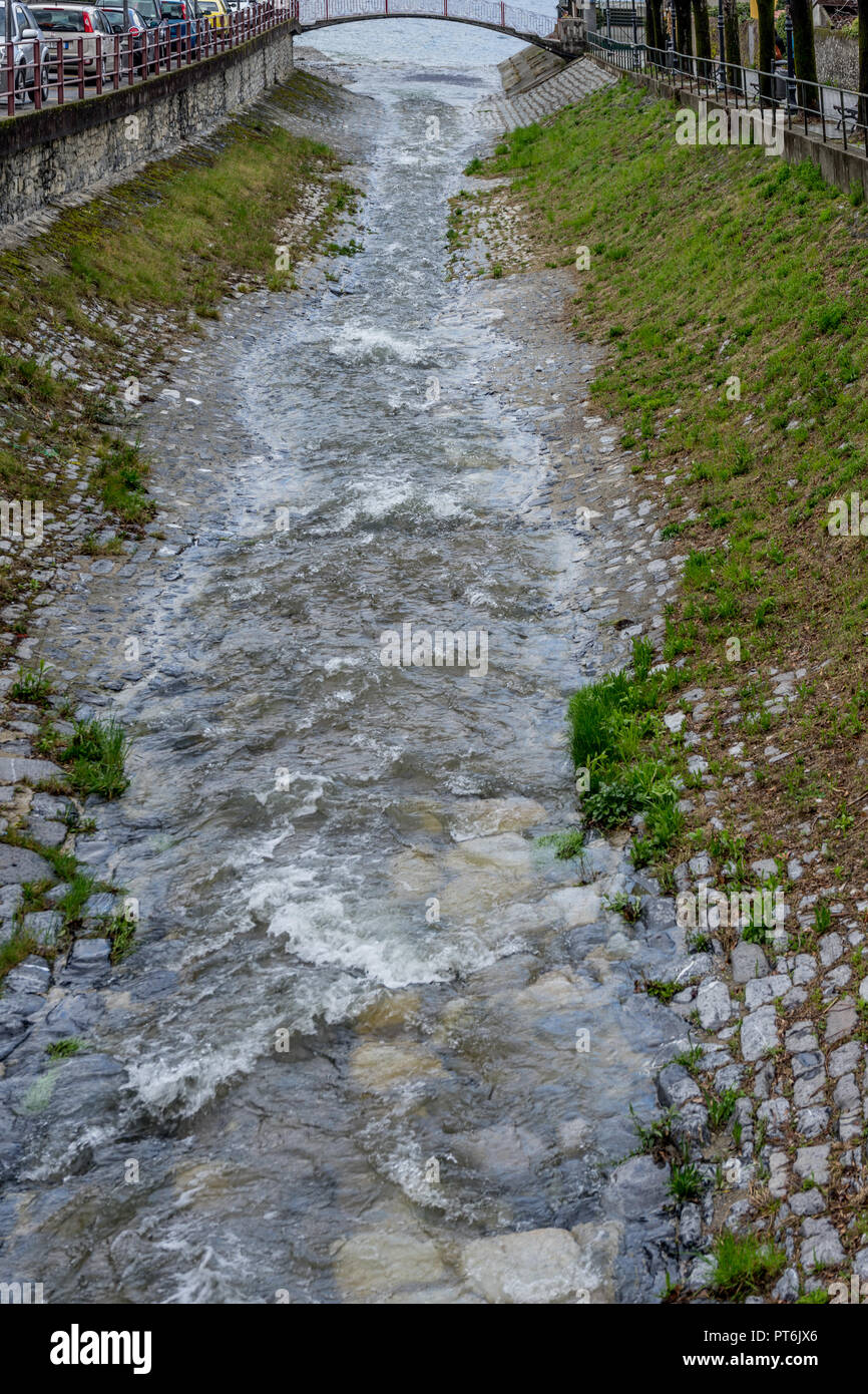 Italy, Varenna, Lake Como, a stream going down the river Stock Photo ...