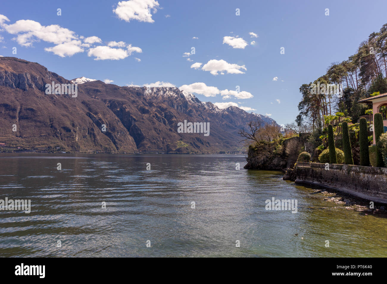 Europe, Italy, Bellagio, Lake Como, a body of water with a mountain in ...