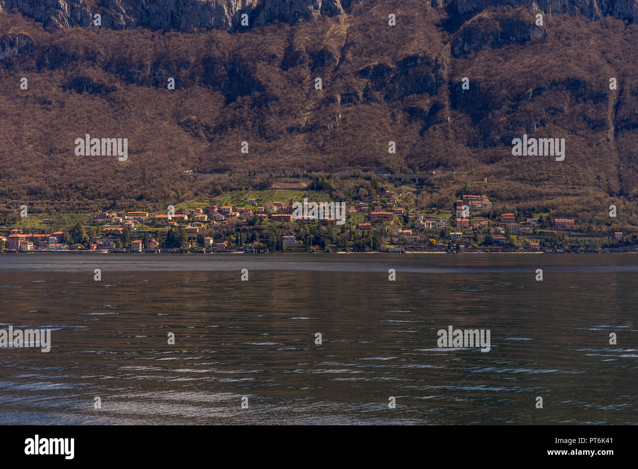 Europe, Italy, Bellagio, Lake Como, a body of water with a mountain in ...