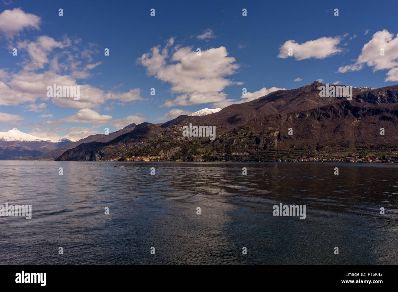 Europe, Italy, Bellagio, Lake Como, a body of water with a mountain in ...