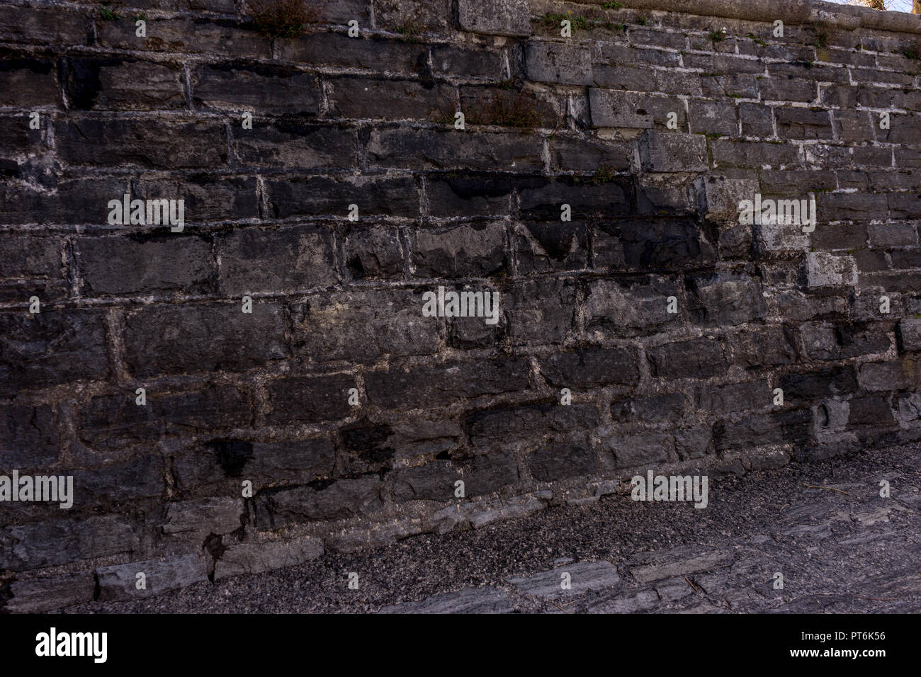 Europe, Italy, Bellagio, Lake Como, a stone building that has a sign on ...