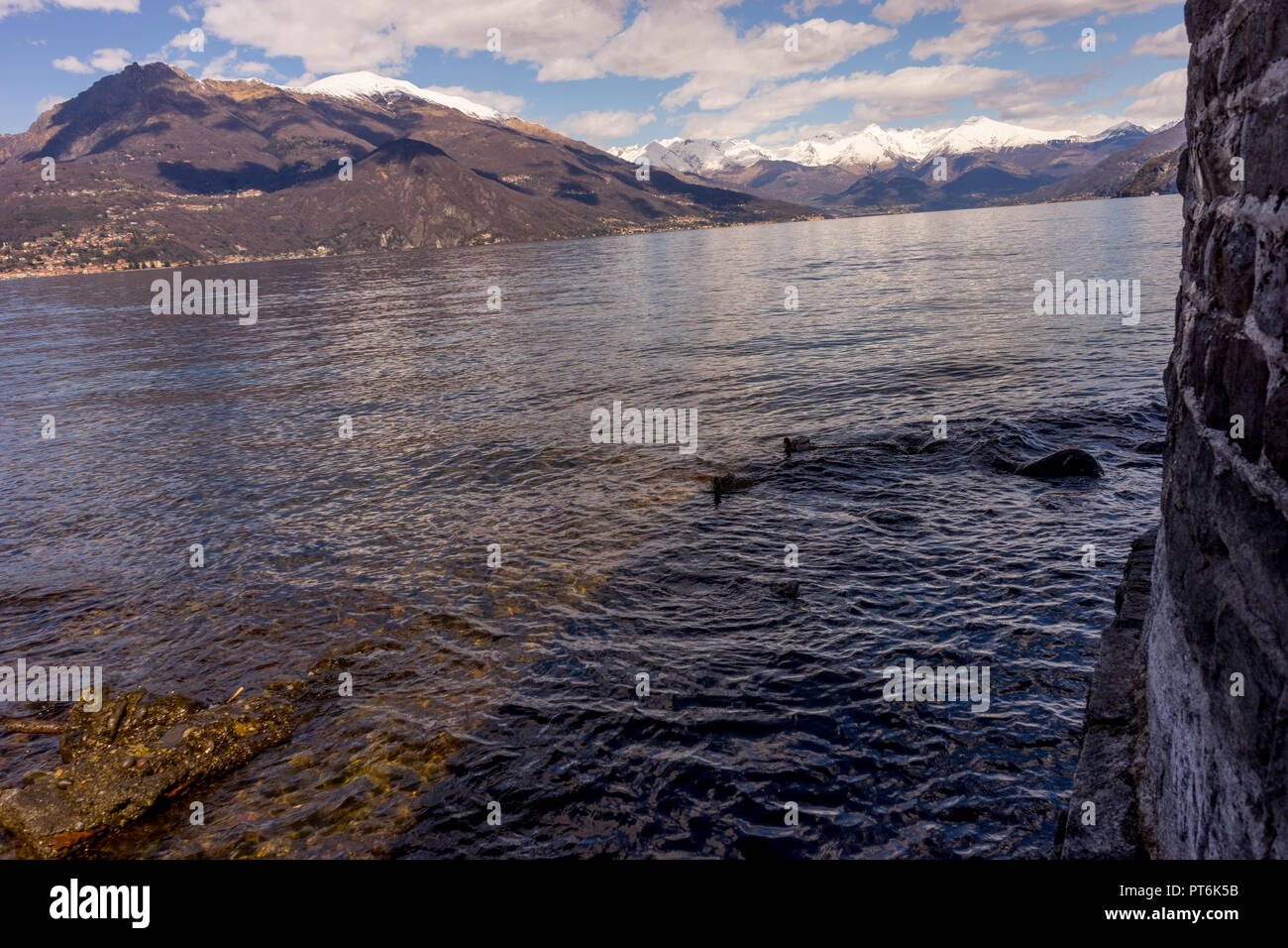 Europe, Italy, Bellagio, Lake Como, a body of water with a mountain in ...