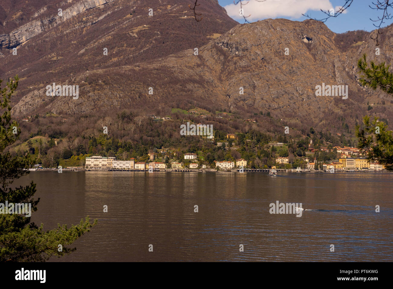 Europe, Italy, Bellagio, Lake Como, a body of water with a mountain in ...