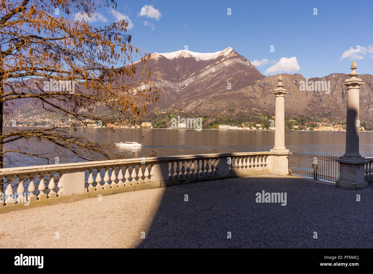 Italy, Bellagio, Lake Como, fence overlooking SCENIC VIEW OF SNOWCAPPED ...