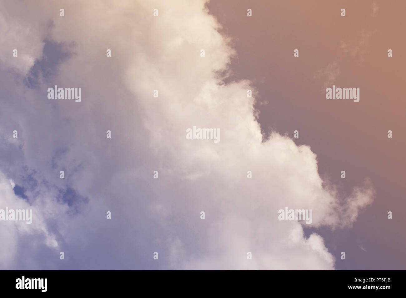 Nature background. Fluffy soft clouds in sky toned Stock Photo - Alamy