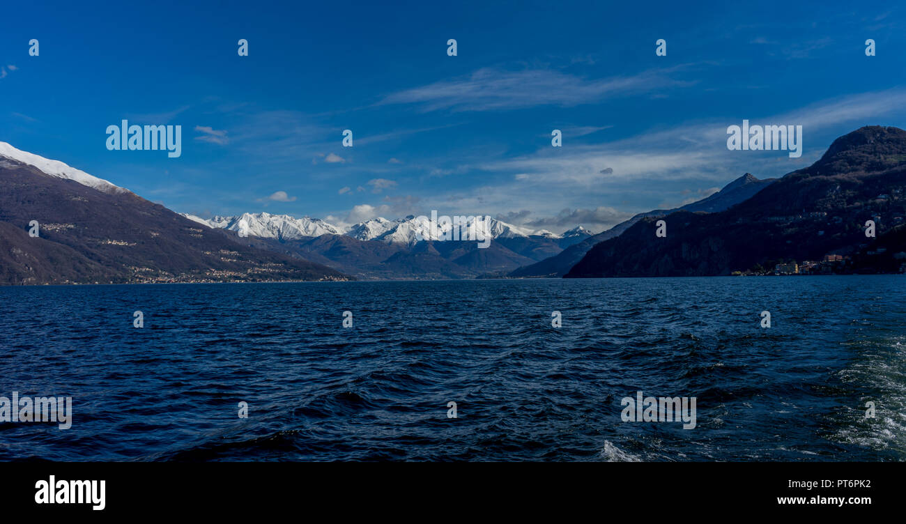 Italy, Bellagio, Lake Como with snow capped alps mountain Stock Photo ...