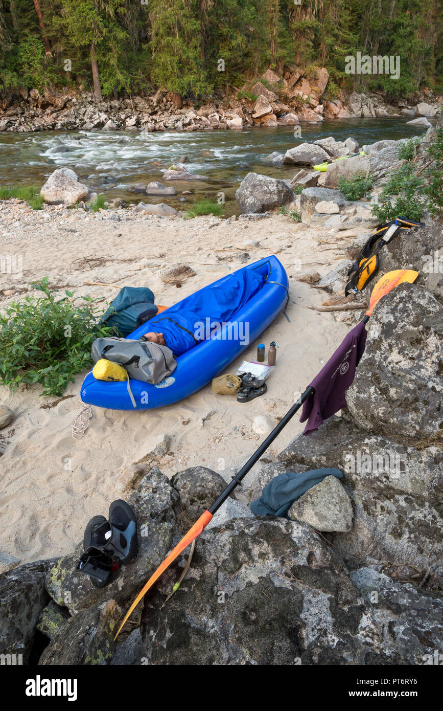 Sleeping in an inflatable kayak along the Selway River in Idaho Stock ...