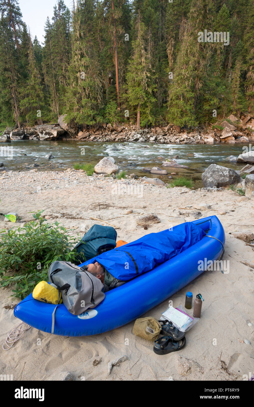 Sleeping in an inflatable kayak along the Selway River in Idaho Stock ...