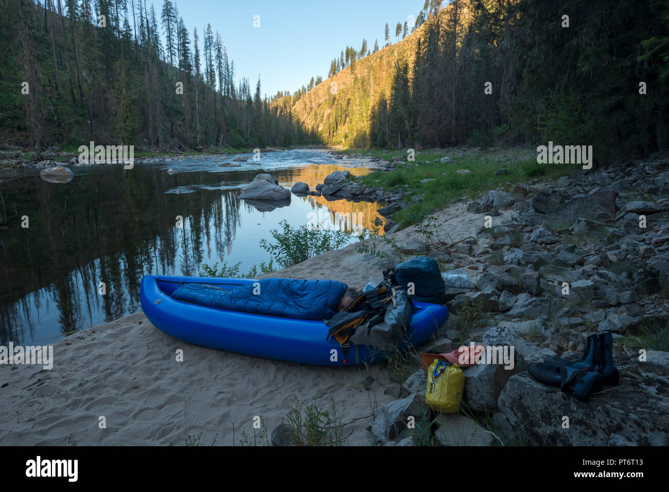 Sleeping in an inflatable kayak at a campsite on Idaho's Selway River ...