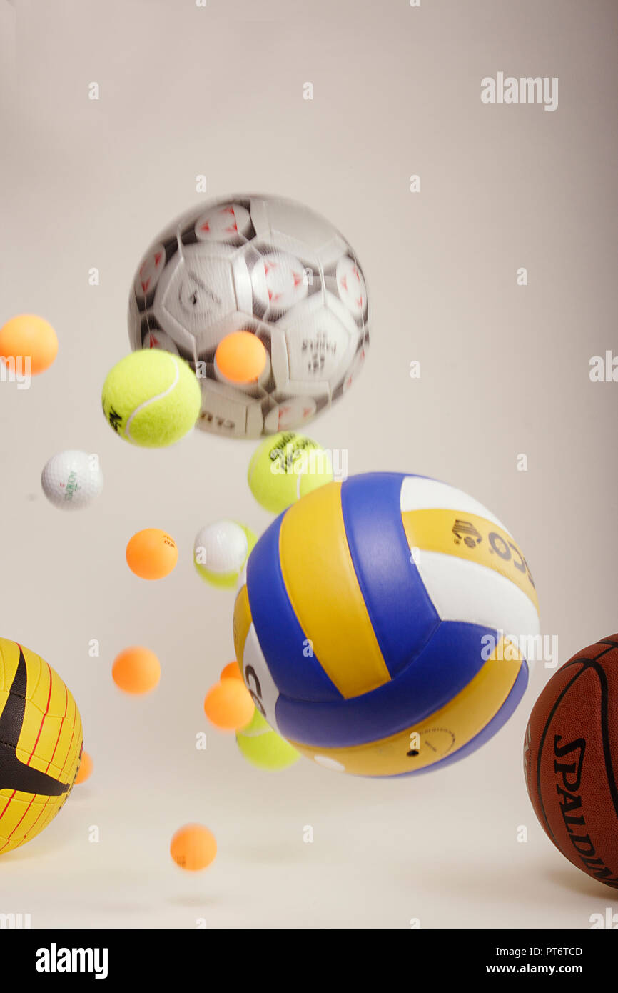 STILL LIFE OF ASSORTED BALLS N MOTION OF VARIOUS SPORTS THROWBALL ...