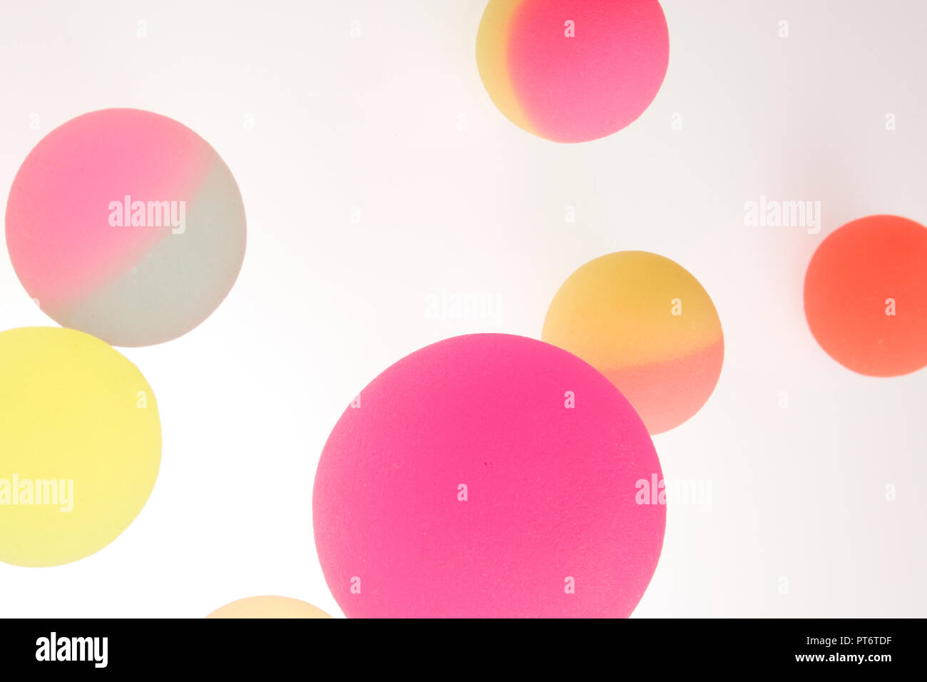 STILL LIFE OF ASSORTED BALLS OF ON A PLAIN BACKLIT BACKGROUND Stock ...