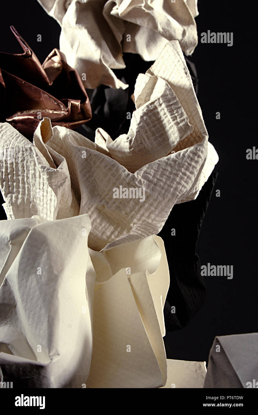 STILL LIFE OF CRUMPLED PAPER ON A BLACK BACKGROUND Stock Photo - Alamy