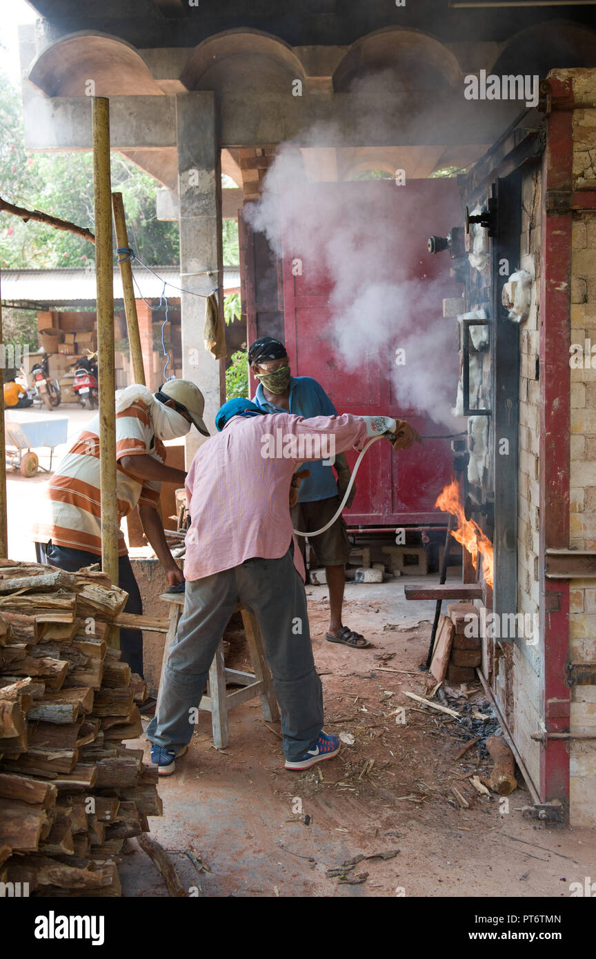 TAMIL NADU, INDIA - April 2018: Soda firing process in pottery ...