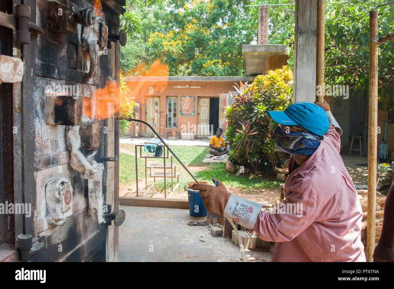 TAMIL NADU, INDIA - April 2018: Soda firing process in pottery ...