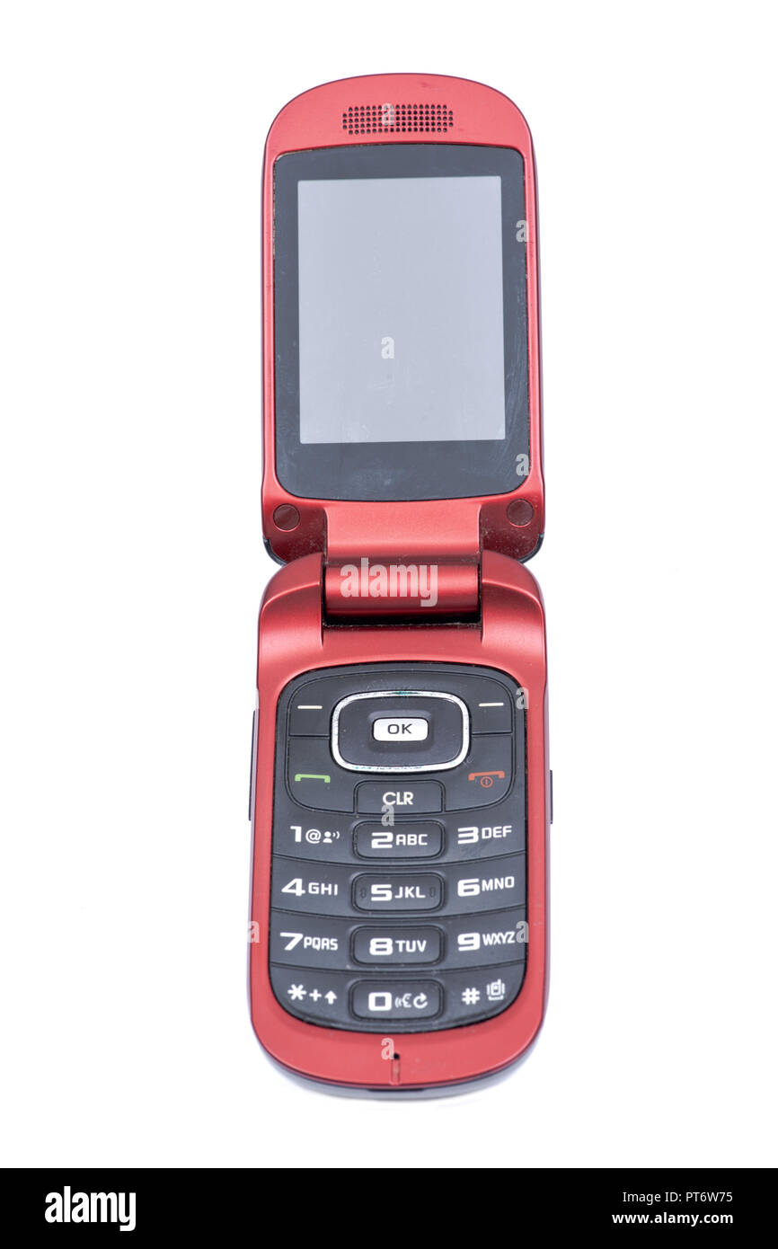 Old used flip cell phone isolated on white background Stock Photo - Alamy